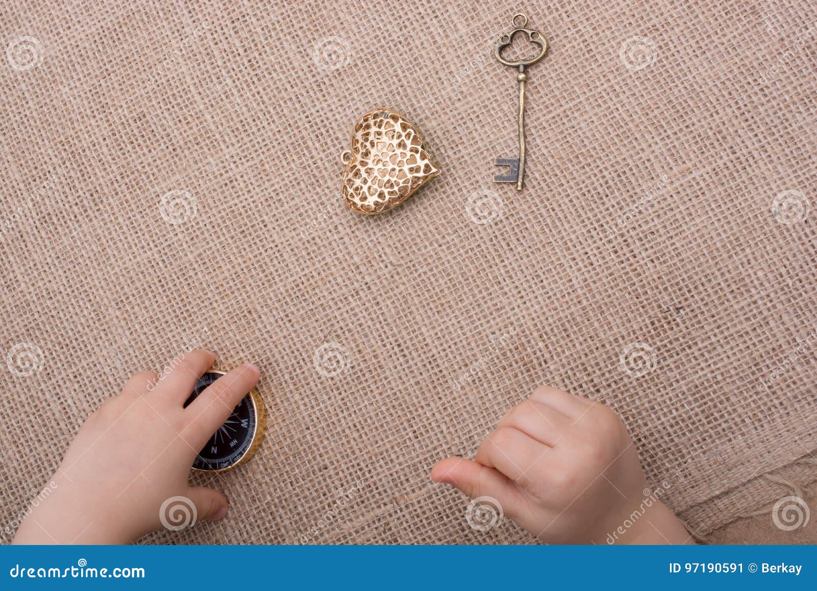 Compass, Key and a Heart Shaped Object Stock Image - Image of holding ...