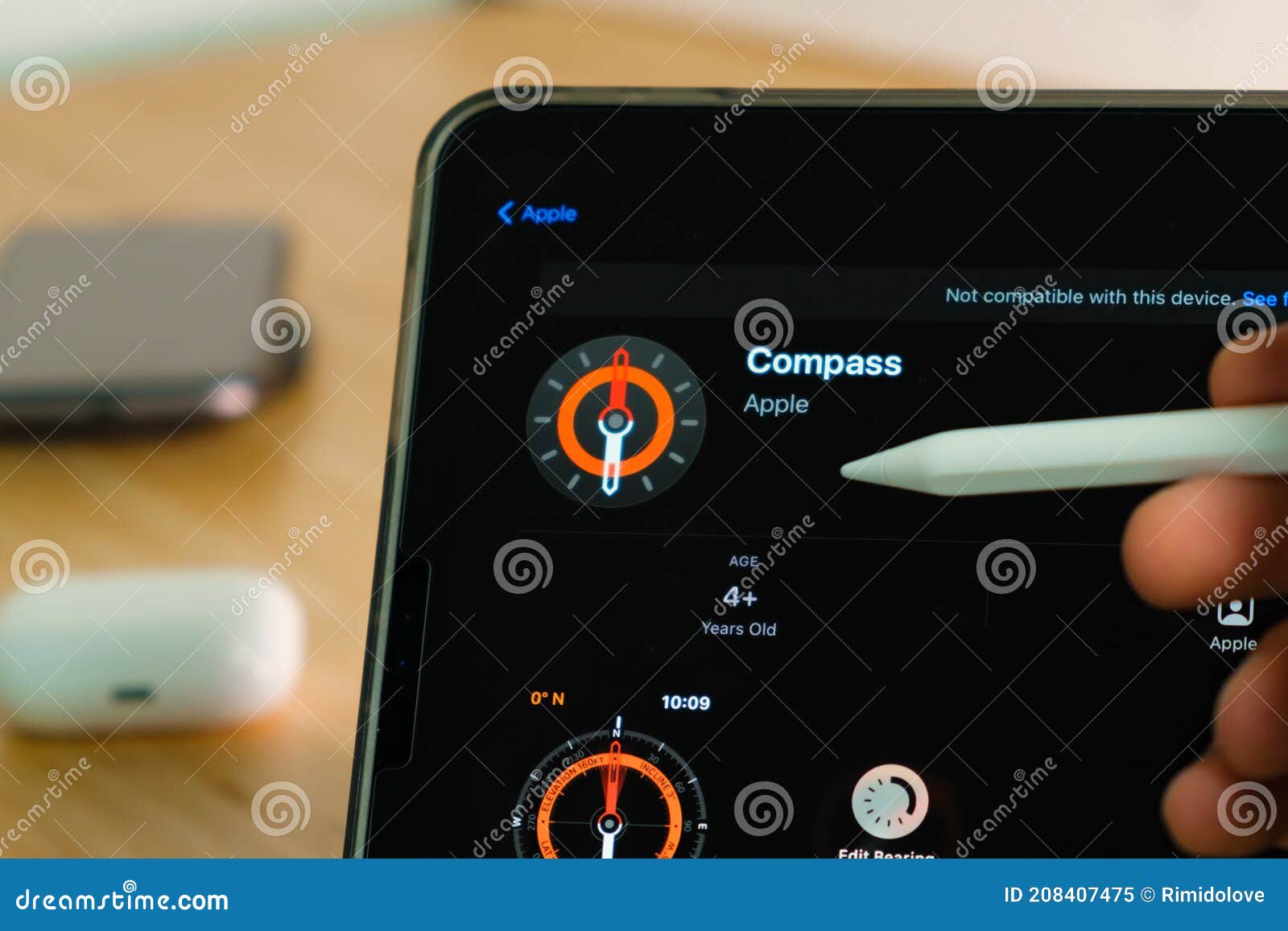 Compass Logo Shown by Apple Pencil on the IPad Pro Tablet Screen. Man ...