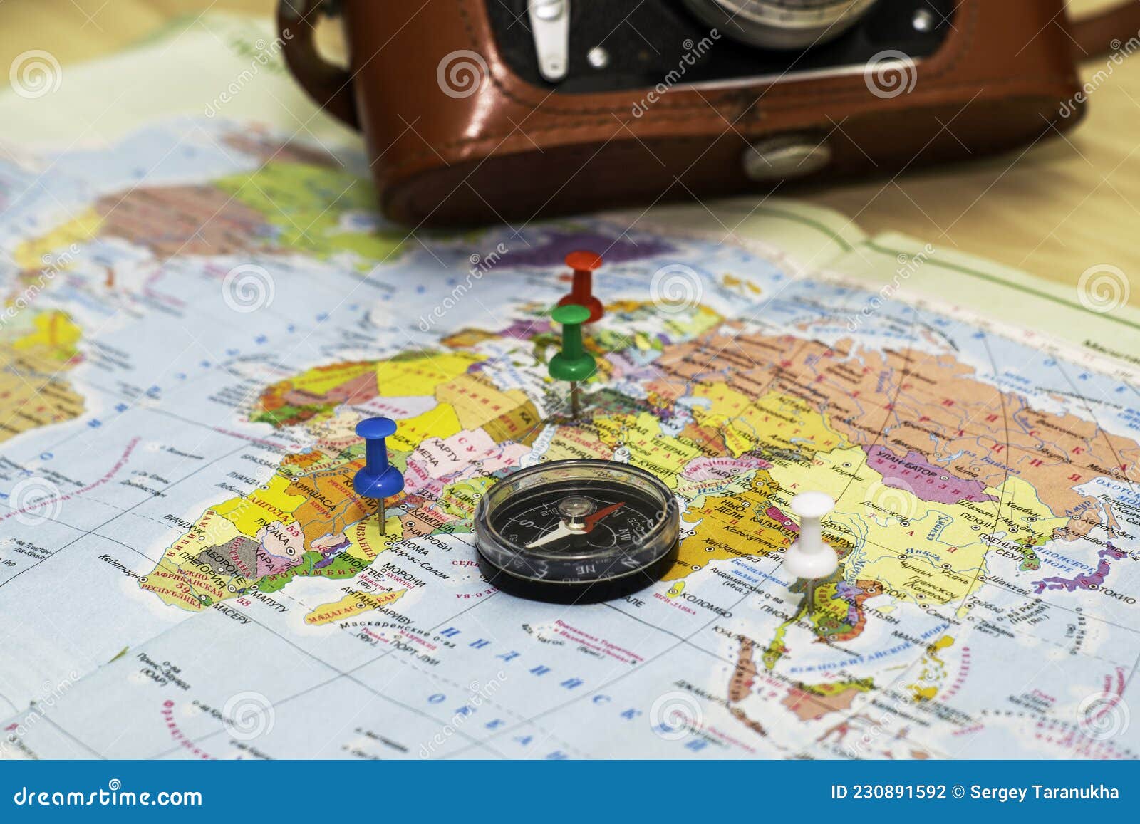 A Compass Lying on a Geographical Map Marks the Place of Travel with ...