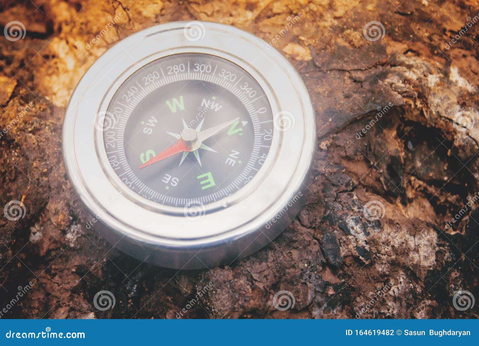 Compass Lying on the Ground Stock Photo - Image of hand, arrow: 164619482