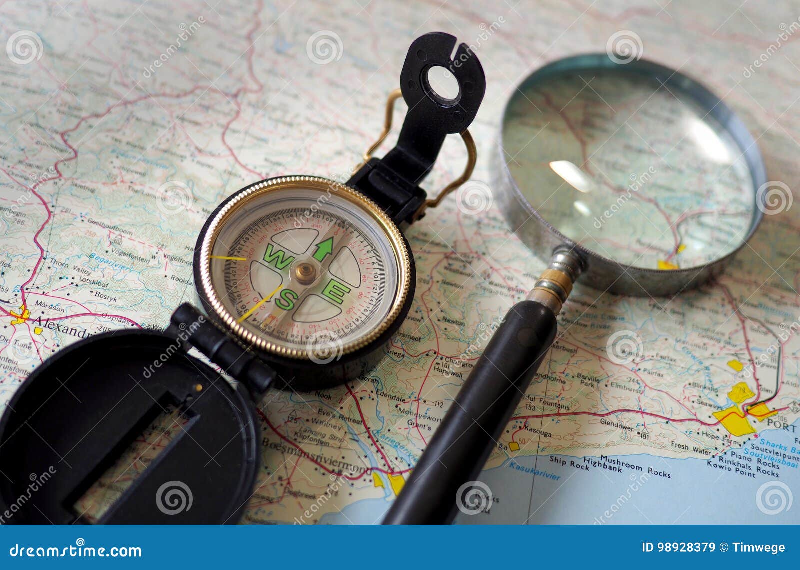 Compass and Magnifying Glass on Top of a Map Stock Image - Image of ...