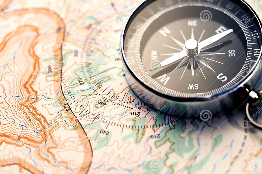 Compass on map stock photo. Image of hiking, hand, canyon - 4866800