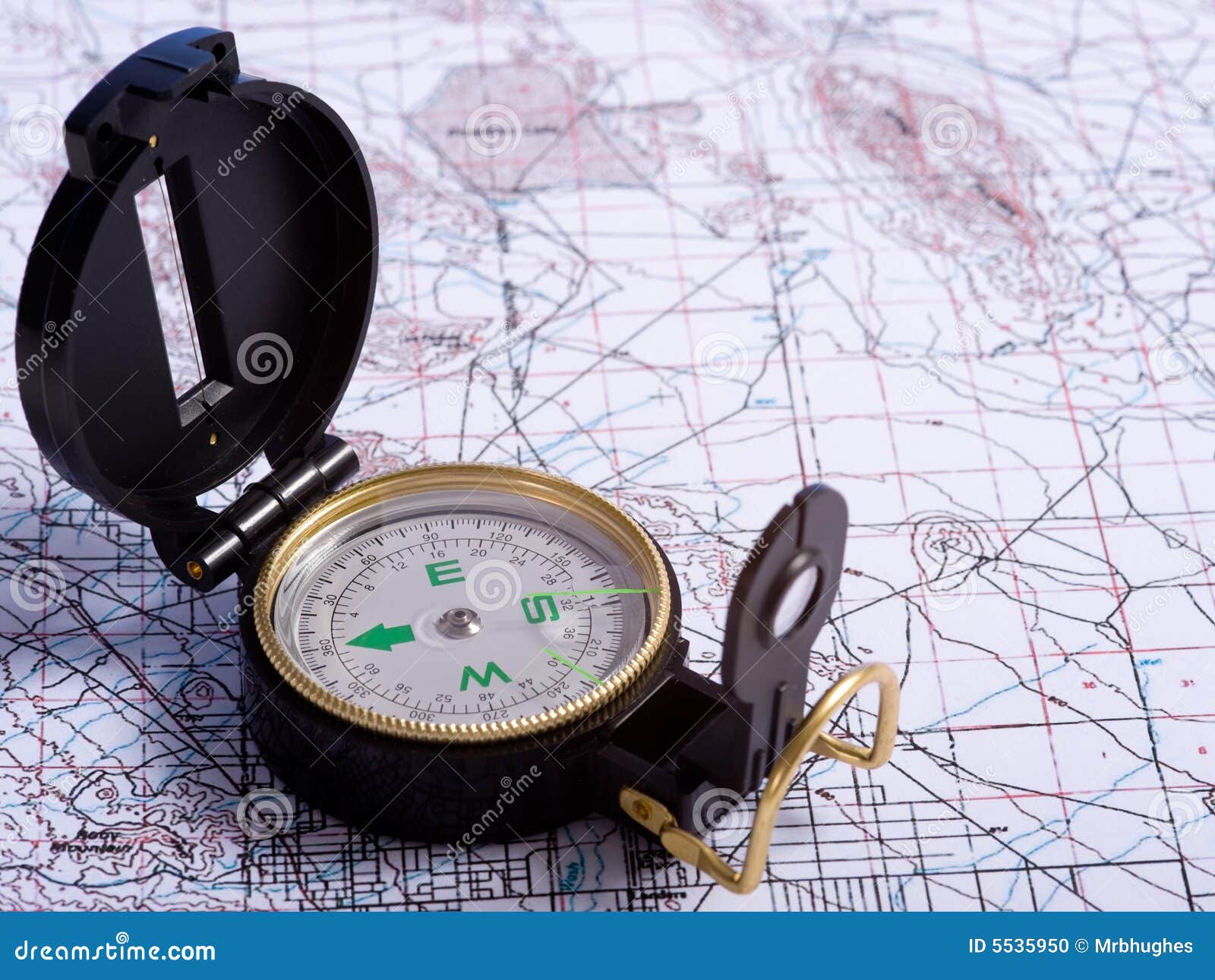 A Compass on a map stock photo. Image of south, engineer - 5535950