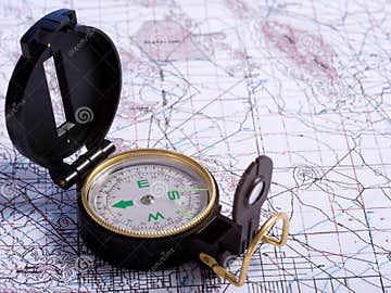 A Compass on a map stock photo. Image of south, engineer - 5535950