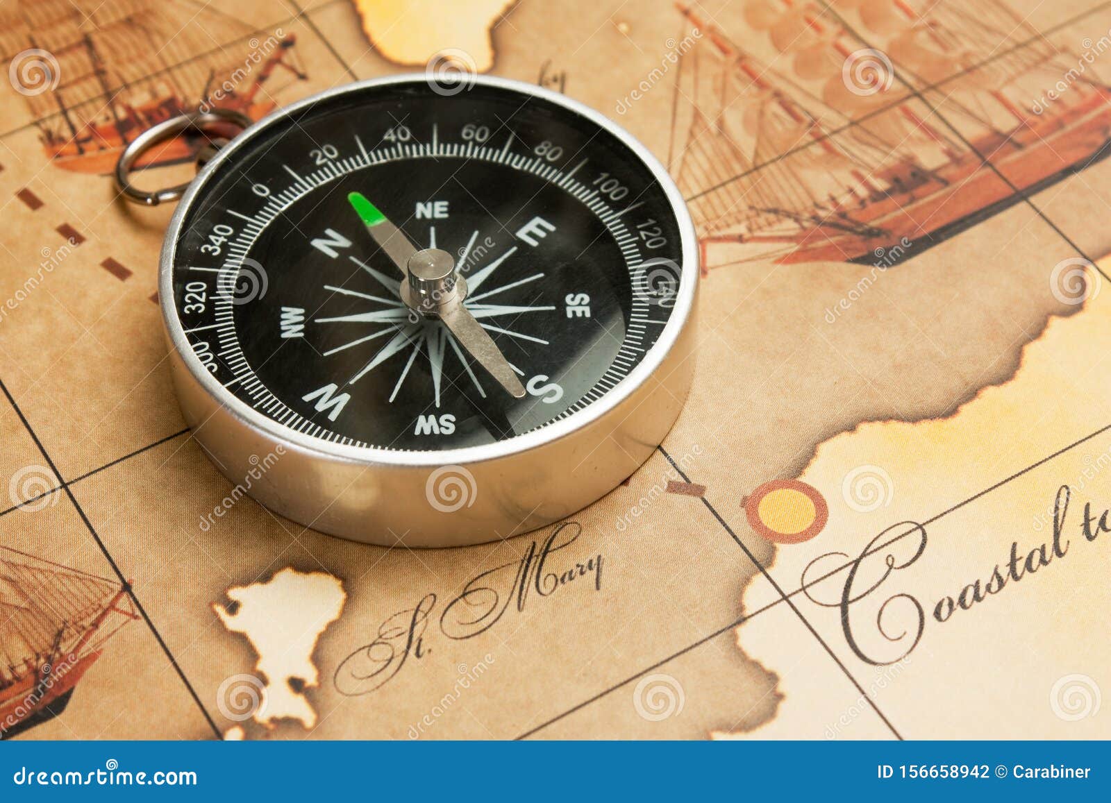 Compass on map stock photo. Image of island, topography - 156658942