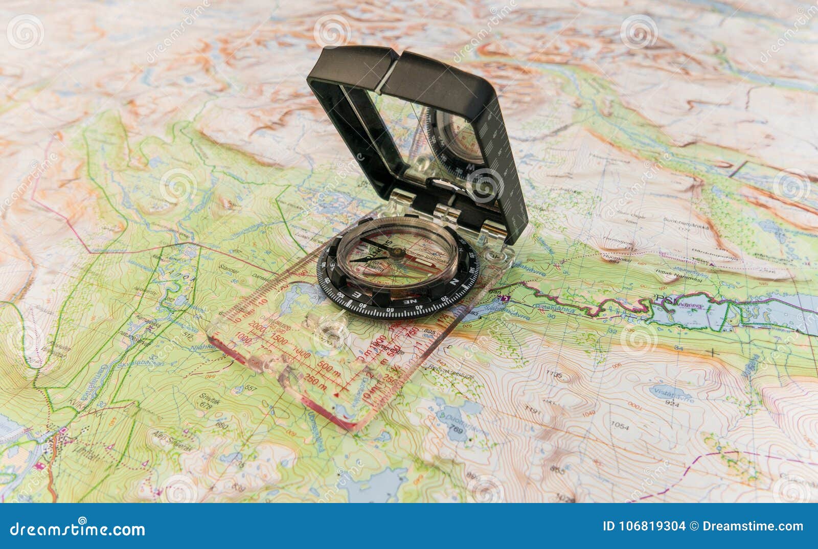 Compass on Map for Finding Way in Wilderness and Life. Stock Photo ...