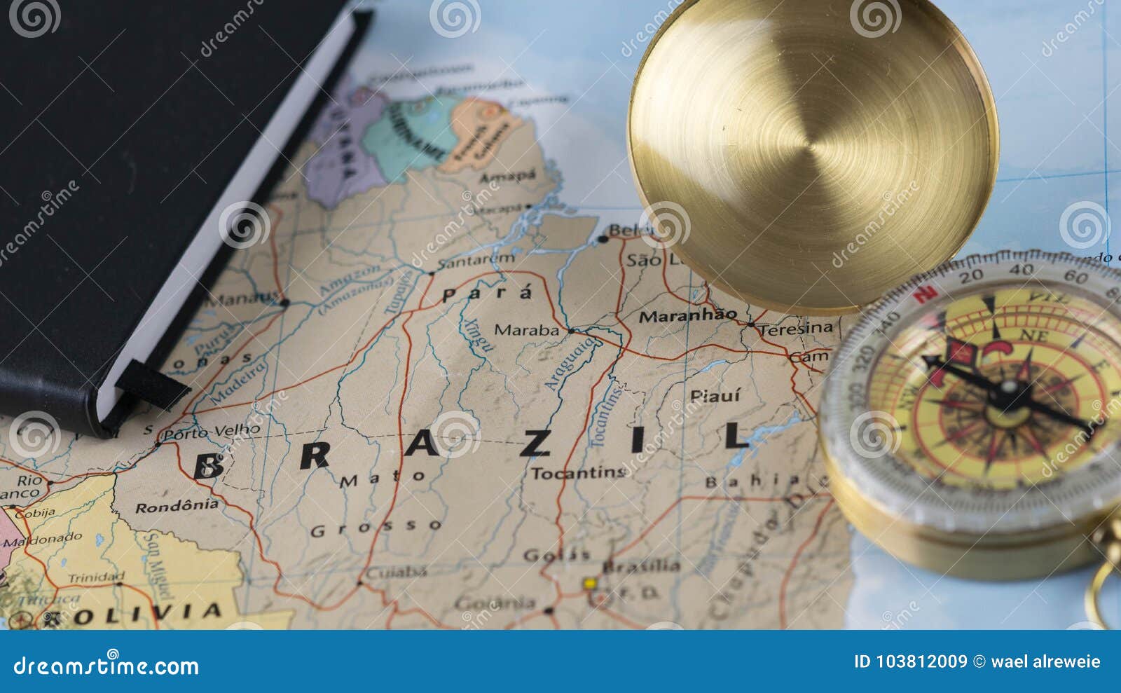 Compass on a Close Up Map Pointing at Brazil and Planning a Travel ... Compass on a Close Up Map Pointing at Brazil and Planning a Travel ...