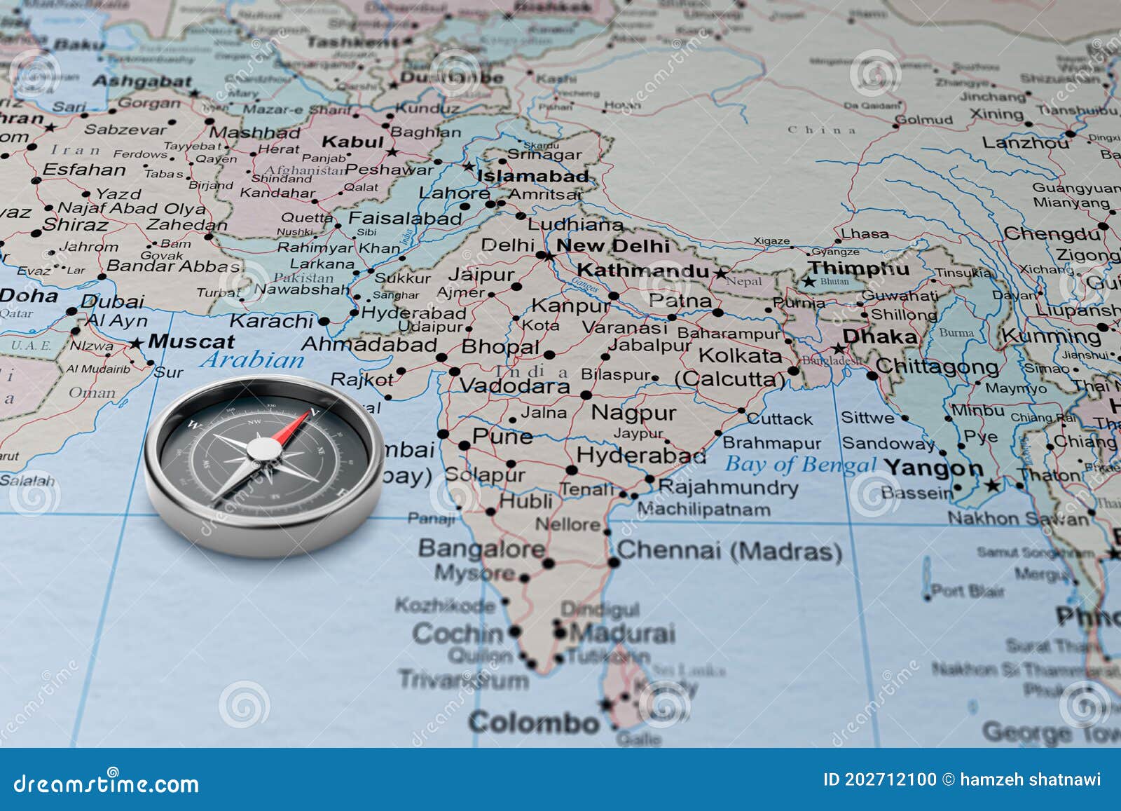 Compass on a Map Pointing at India and Planning a Travel Destination ... Compass on a Map Pointing at India and Planning a Travel Destination ...