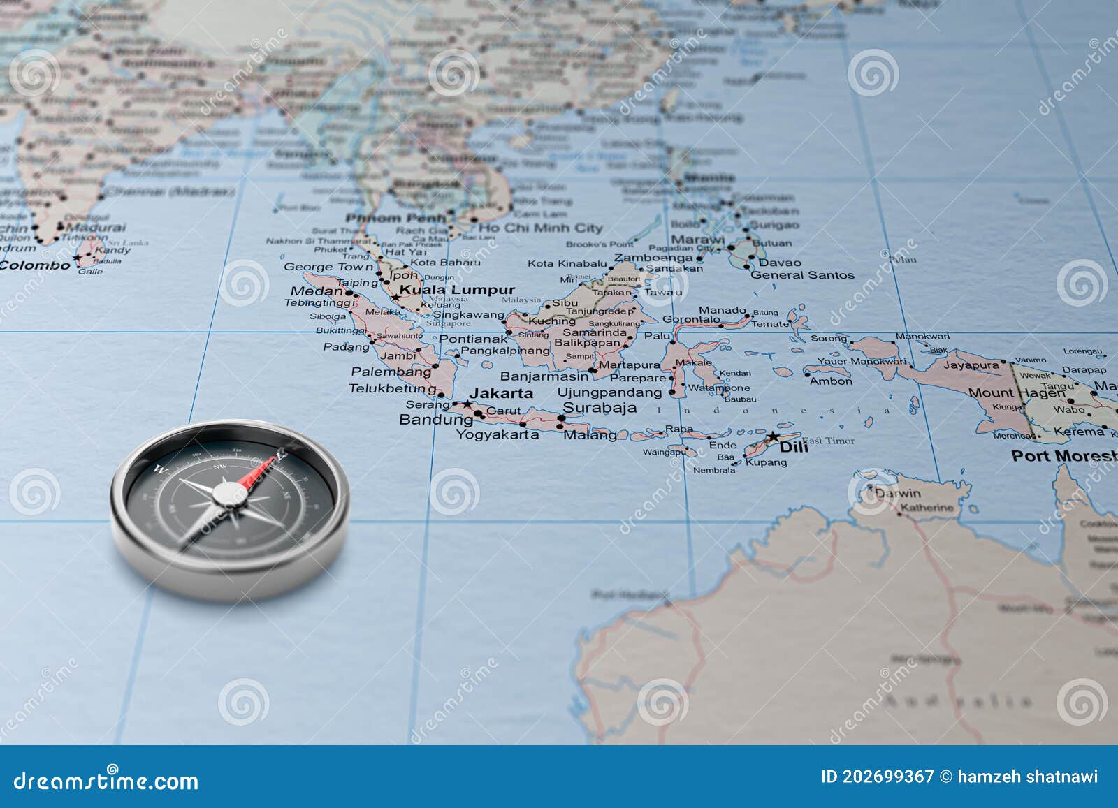 Compass on a Map Pointing at Indonesia and Planning a Travel ... Compass on a Map Pointing at Indonesia and Planning a Travel ...