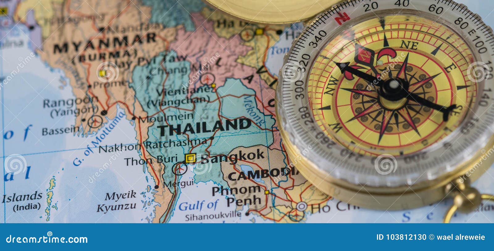Compass on a Close Up Map Pointing at Thailand and Planning a Travel ... Compass on a Close Up Map Pointing at Thailand and Planning a Travel ...