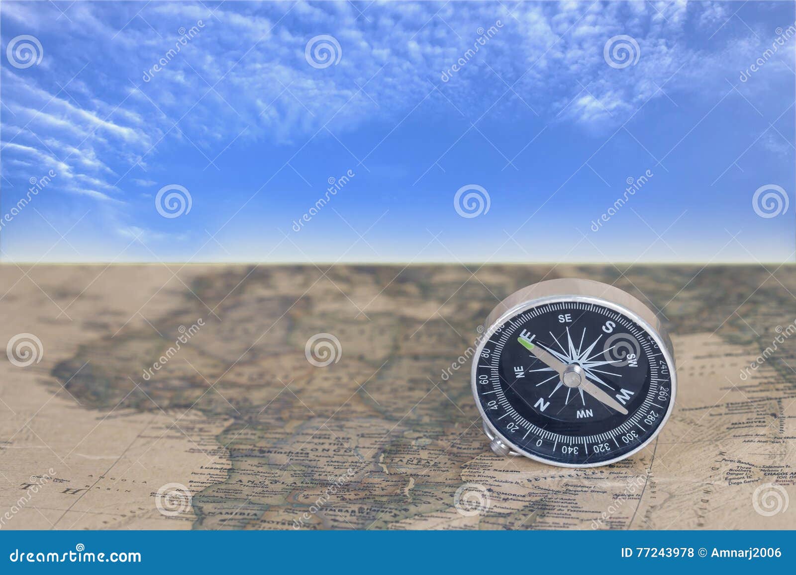 Compass on map with sky stock photo. Image of north, tourism - 77243978