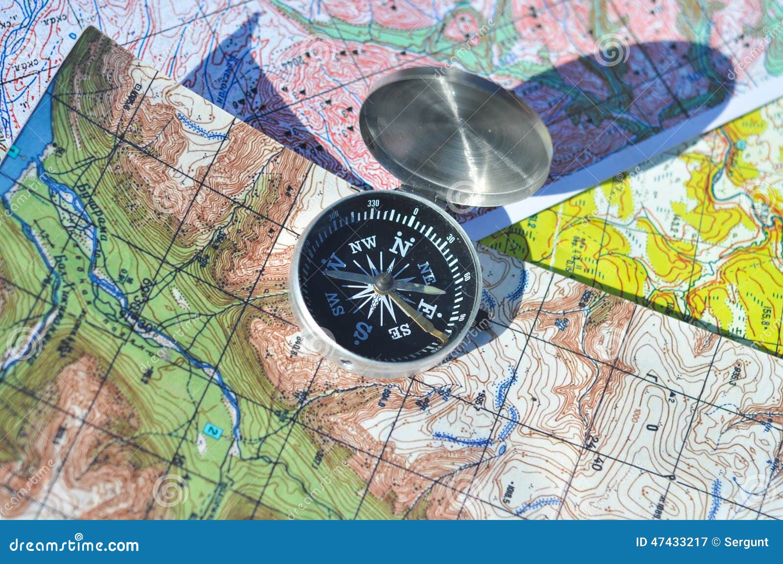 Compass on the maps. stock image. Image of endurance - 47433217