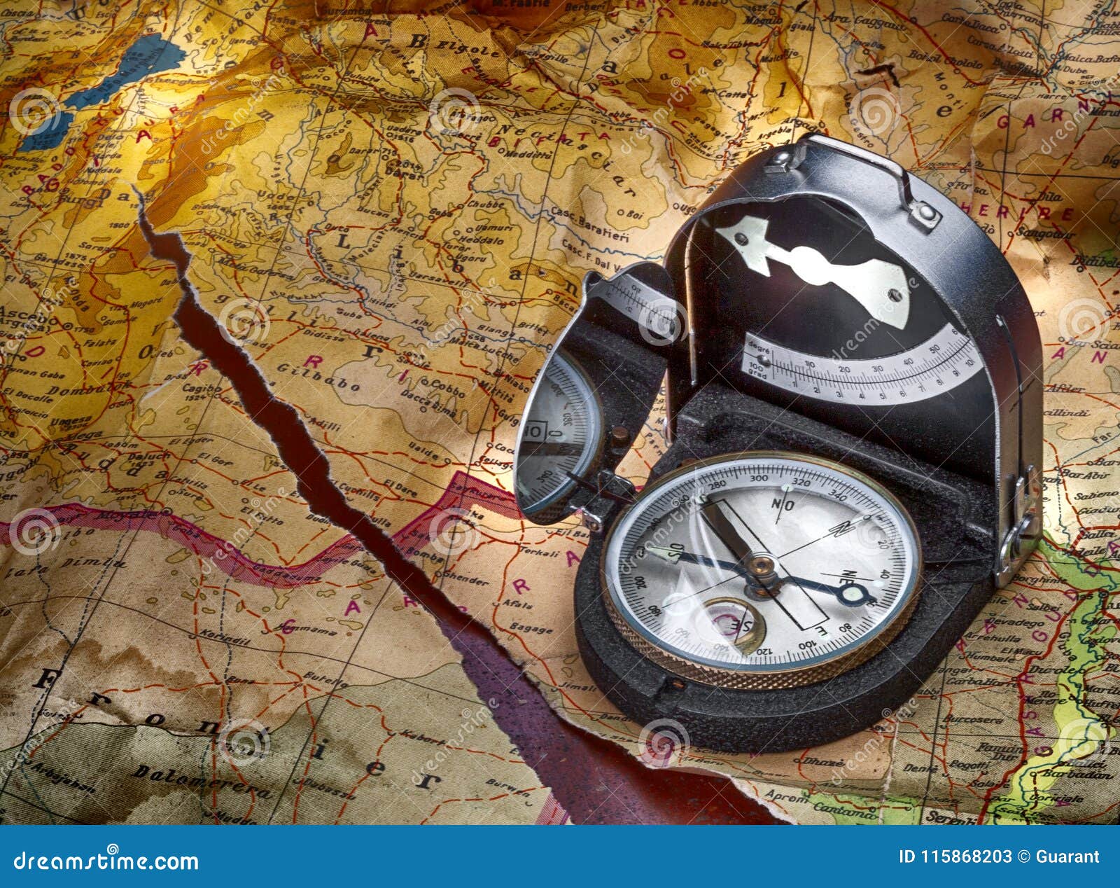 Compass Modern on a Vintage Map Torn Stock Vector - Illustration of ...