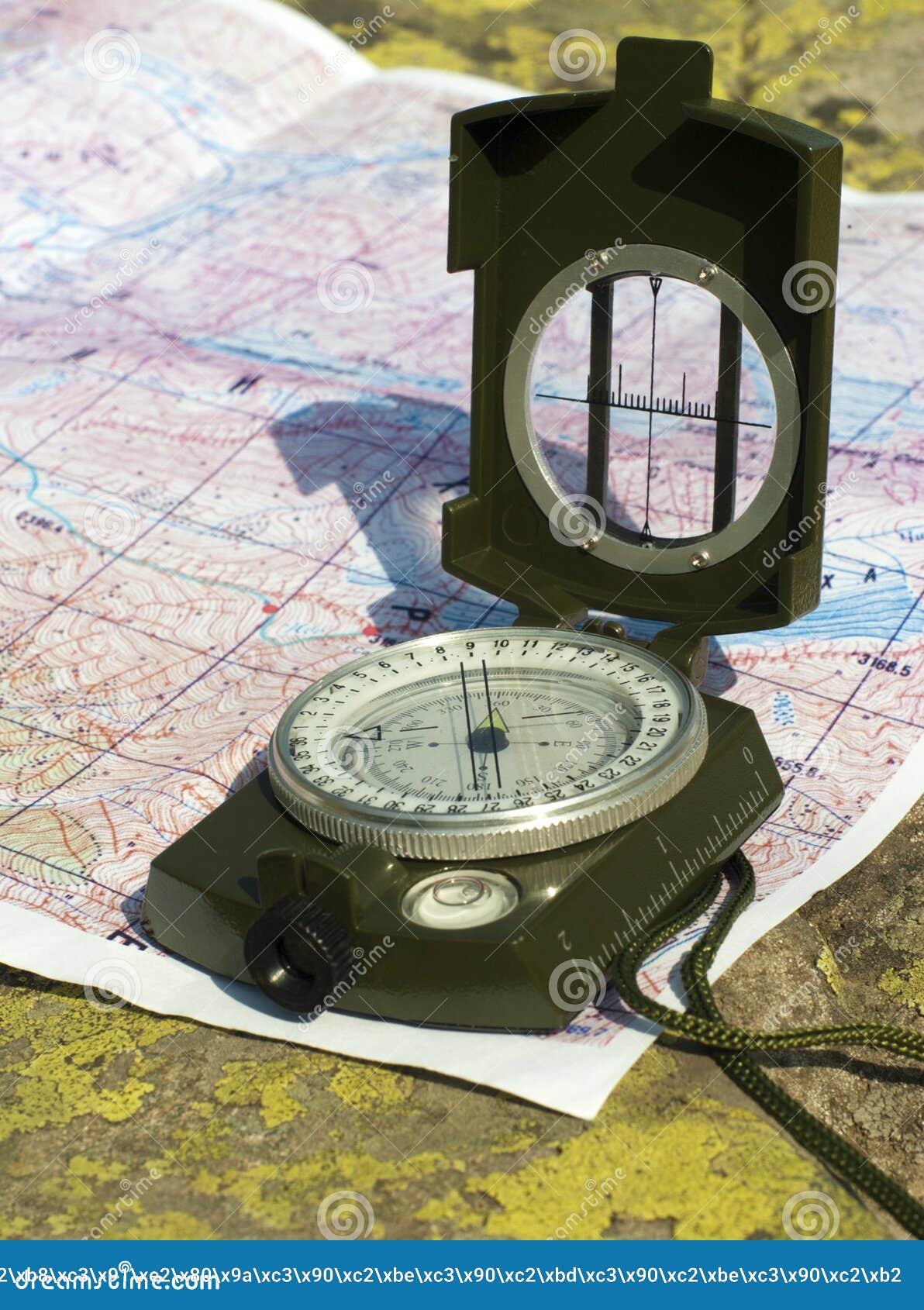 A Compass and a Mountain Map Stock Photo - Image of geography, route ...