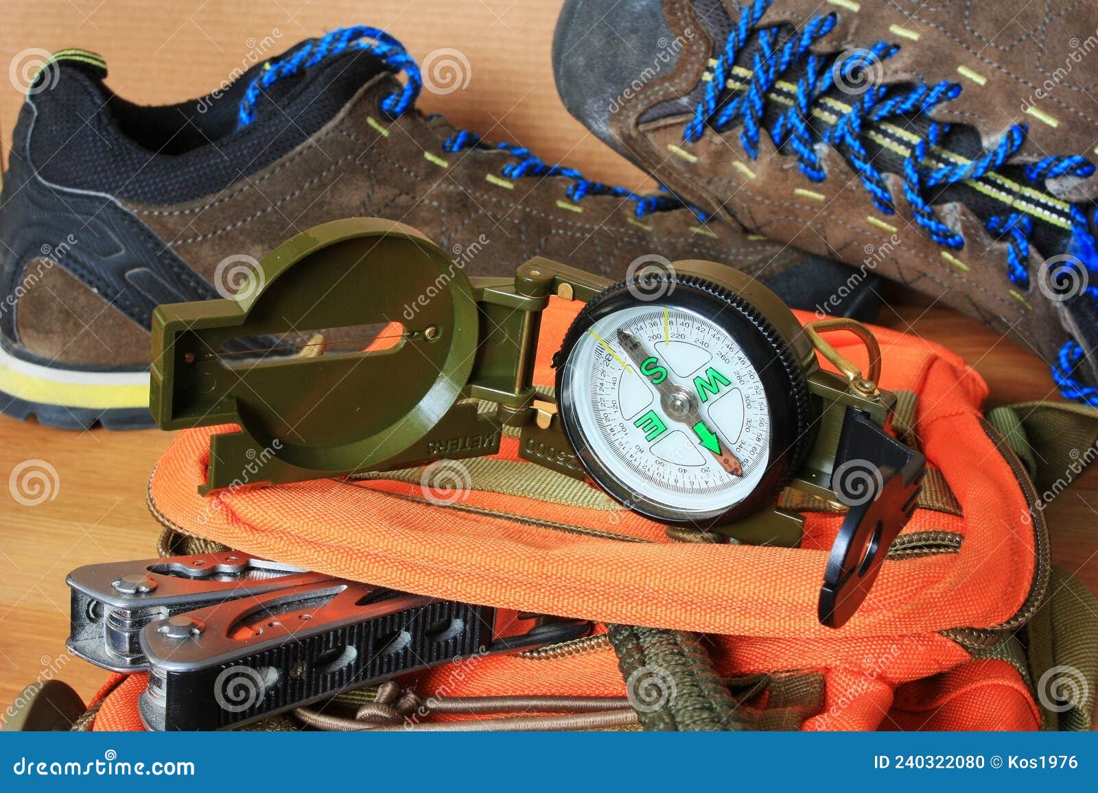 Compass and Multitool are on the Backpack Stock Photo - Image of ...