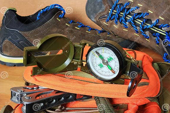 Compass and Multitool are on the Backpack Stock Photo - Image of ...