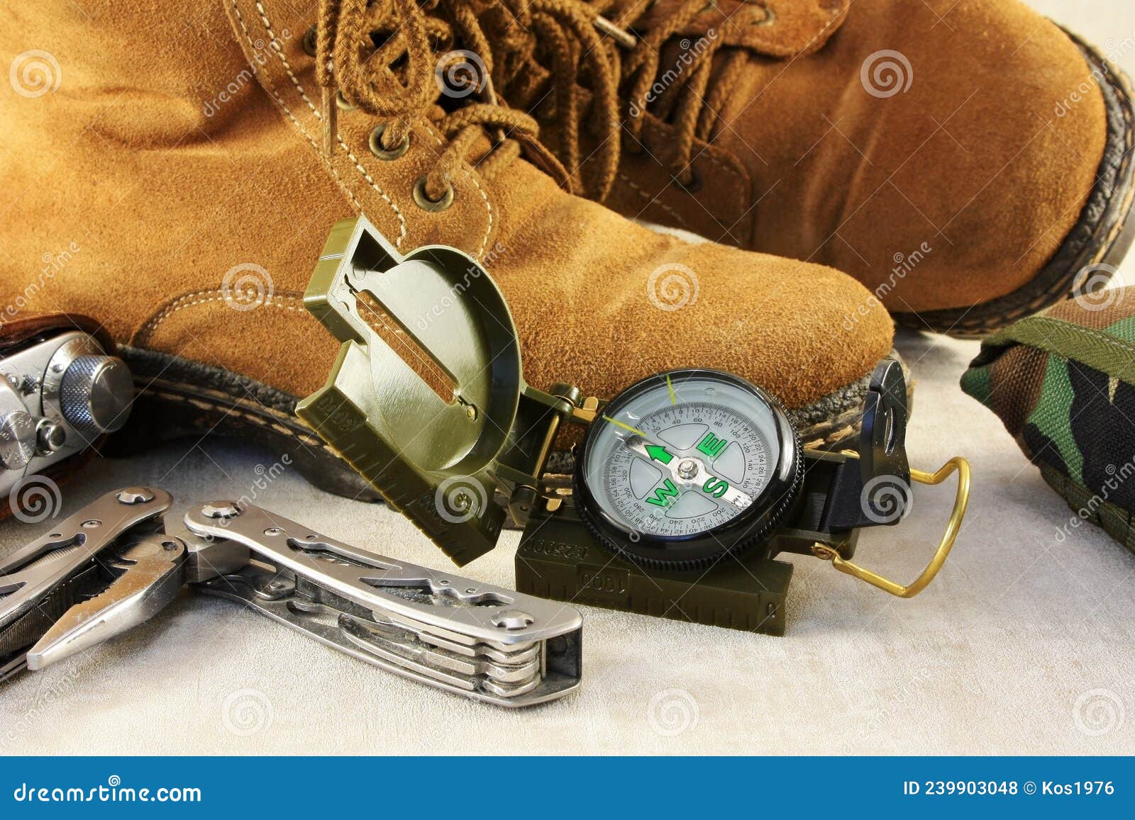 Compass, Multi-tool and Old Hiking Boots Stock Photo - Image of black ...