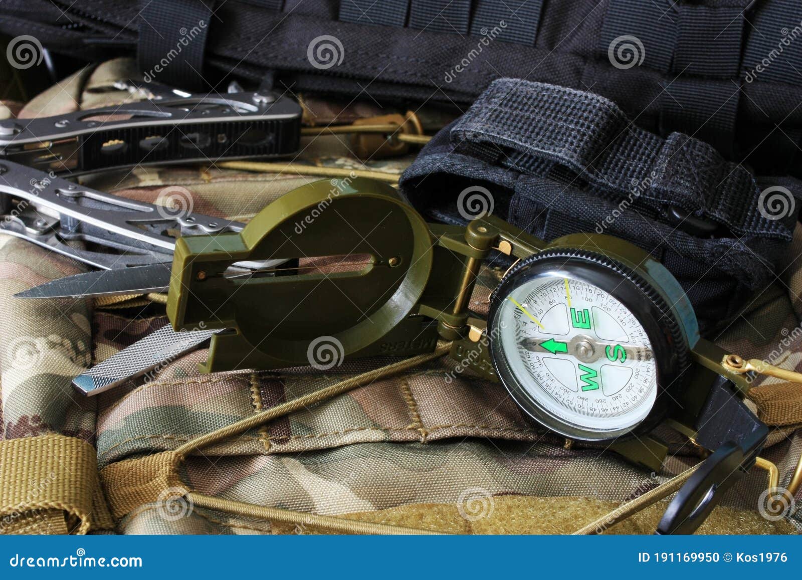 Compass and Multitool are in the Backpack Stock Photo - Image of metal ...