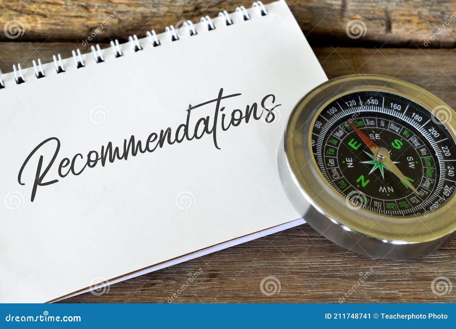 Compass and Notebook Written with Text RECOMMENDATIONS Stock Image ...