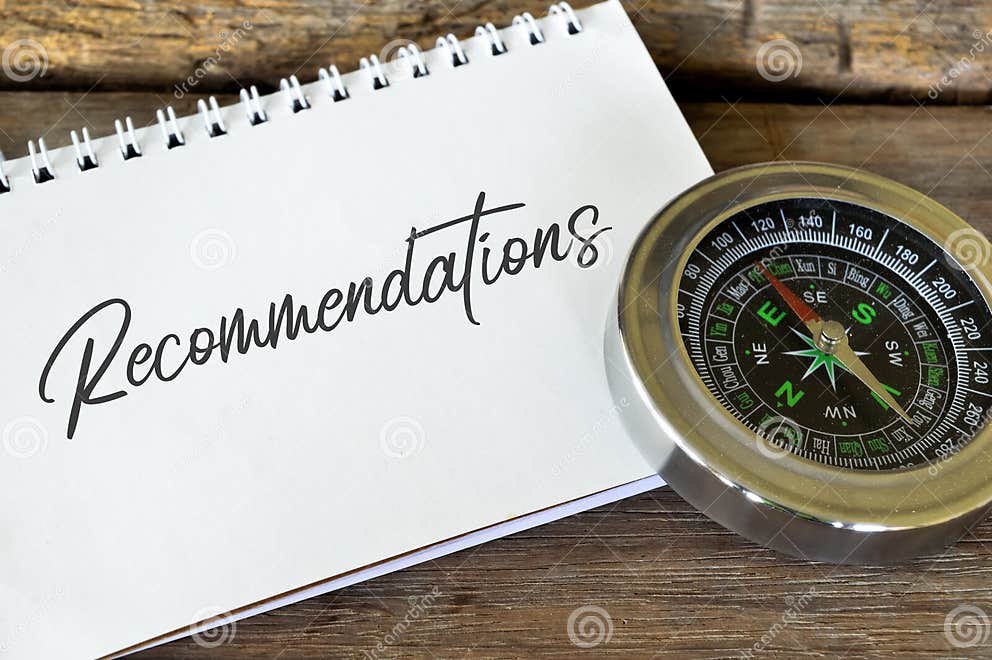 Compass and Notebook Written with Text RECOMMENDATIONS Stock Image ...