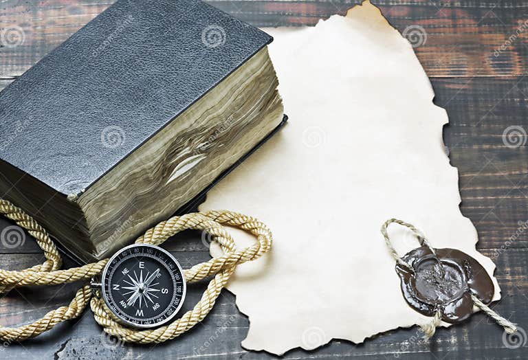 Compass and an old book stock photo. Image of direction - 19160960