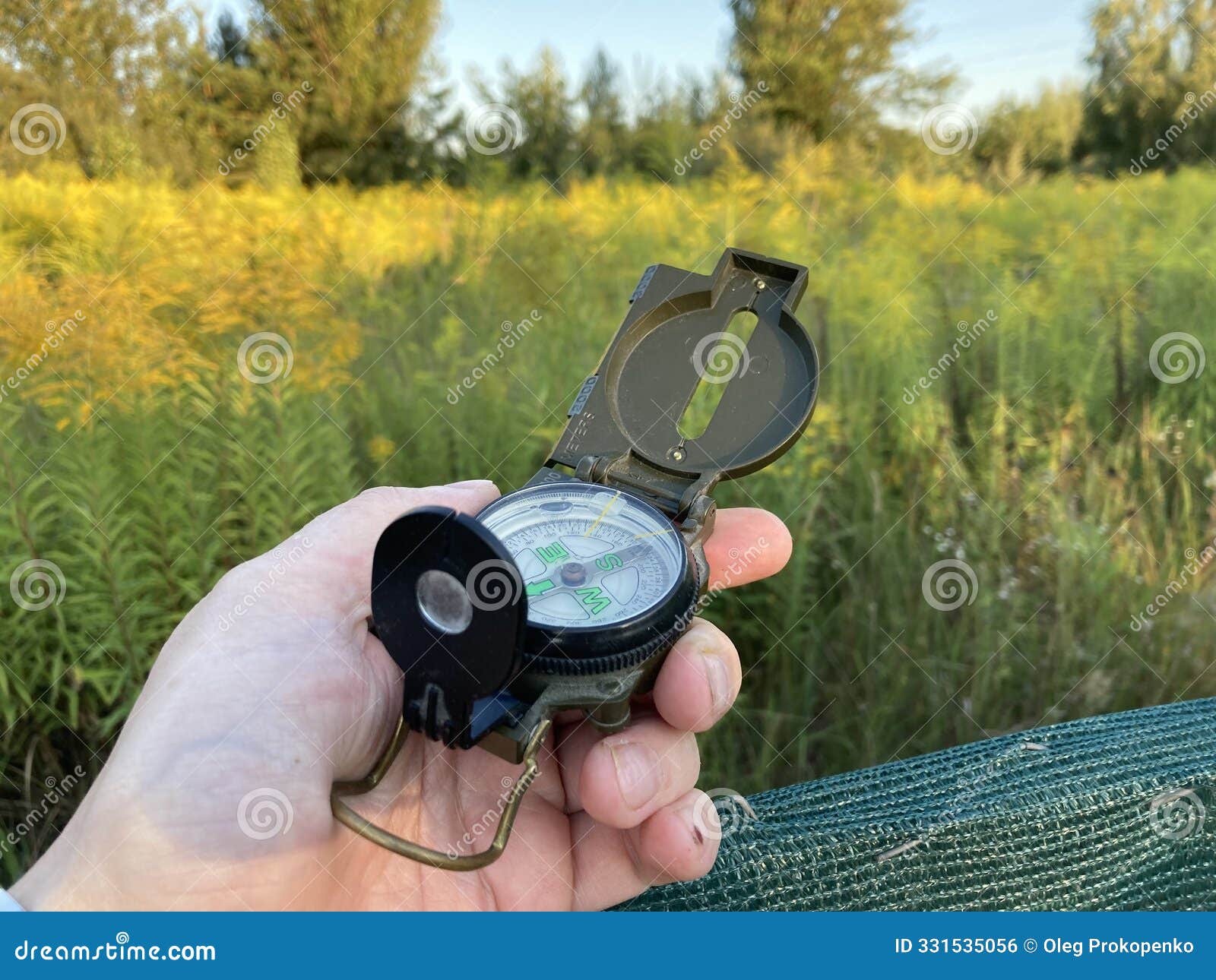 Compass for Orientation on the Terrain during a Hike Stock Photo ...