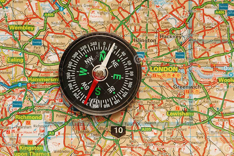 Compass over the map of UK stock image. Image of journey - 8053977