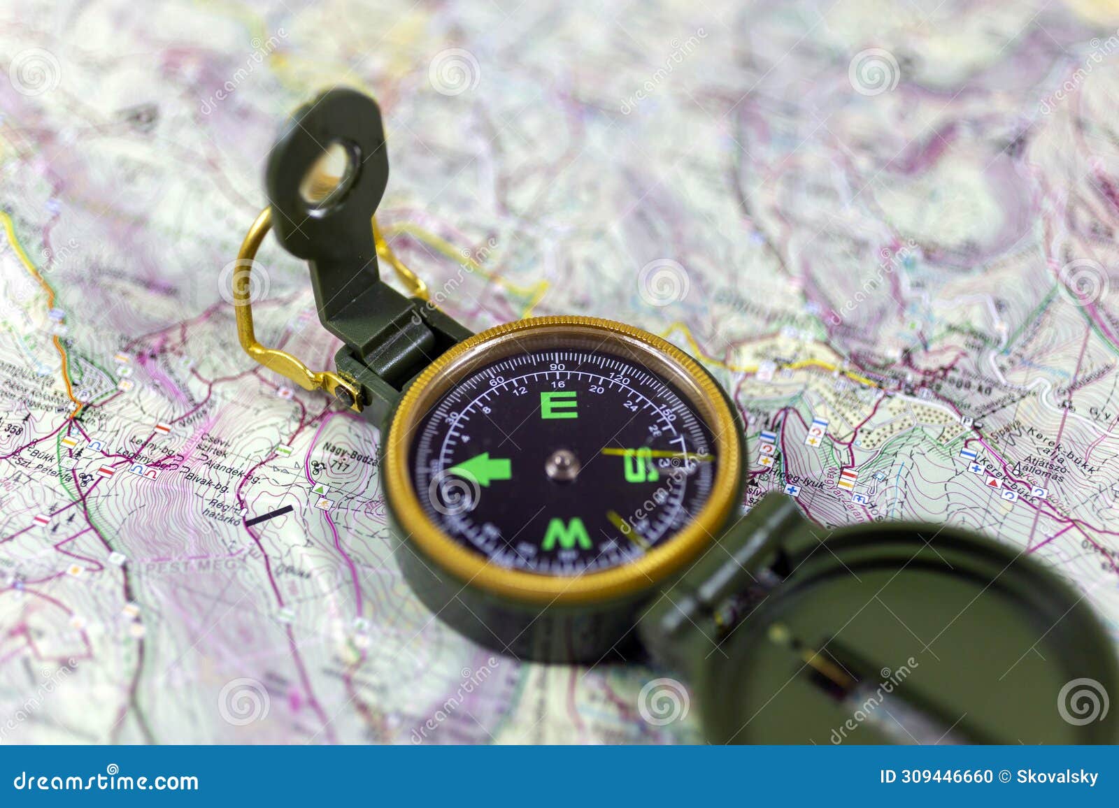 Compass on a paper map stock photo. Image of symbol - 309446660
