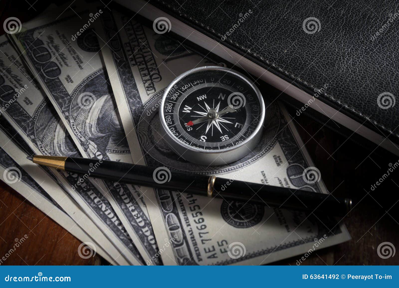 Compass and Pen on Money with Book. Stock Photo - Image of journey ...