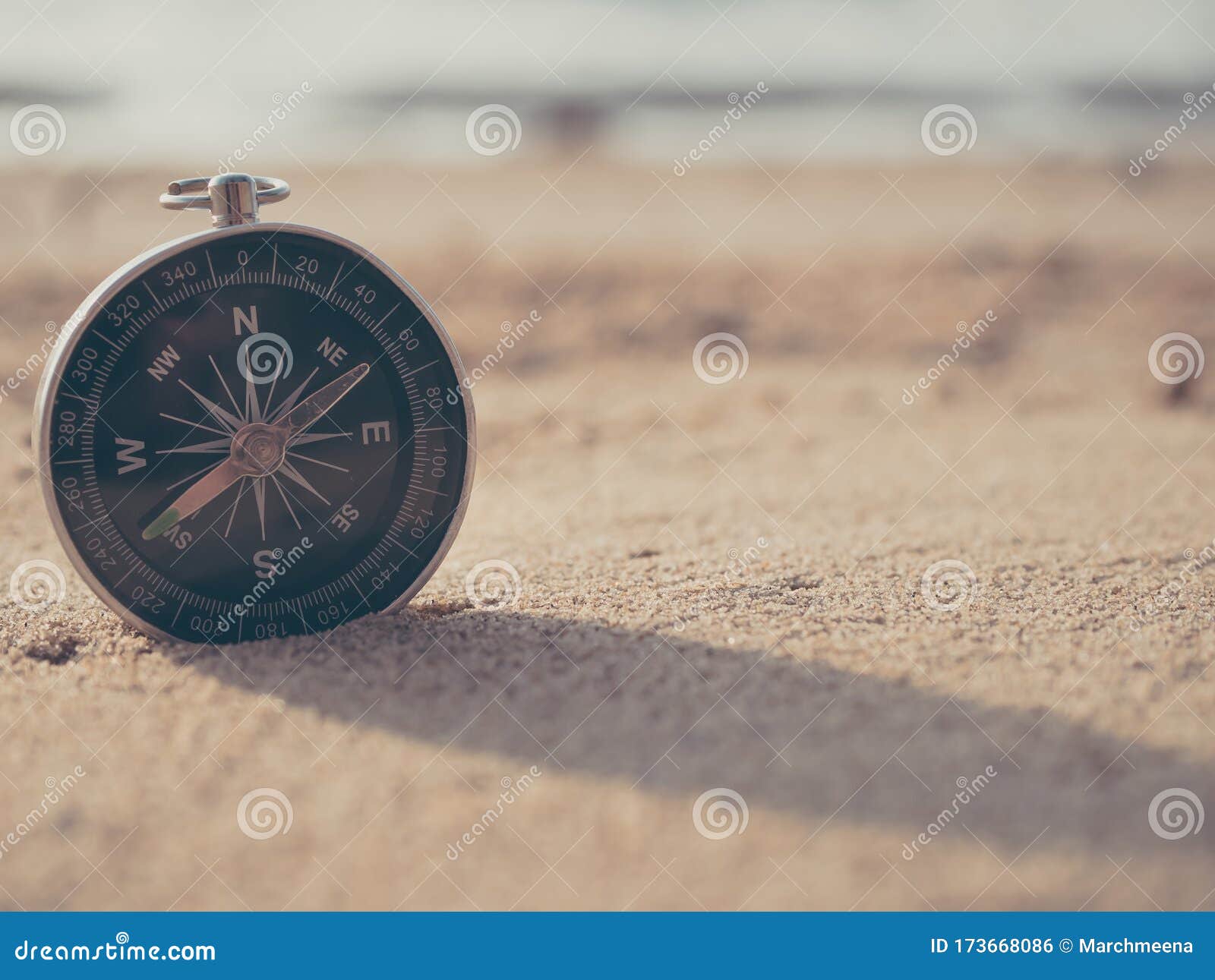 Compass is Placed on the Beach and Sunshine in the Evening Sunset Stock ...