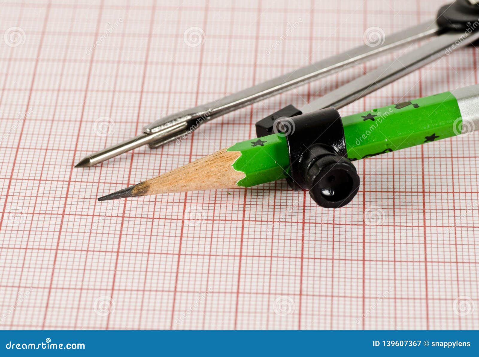 A Compass Placed On A Graph Paper Royalty-Free Stock Photo ...