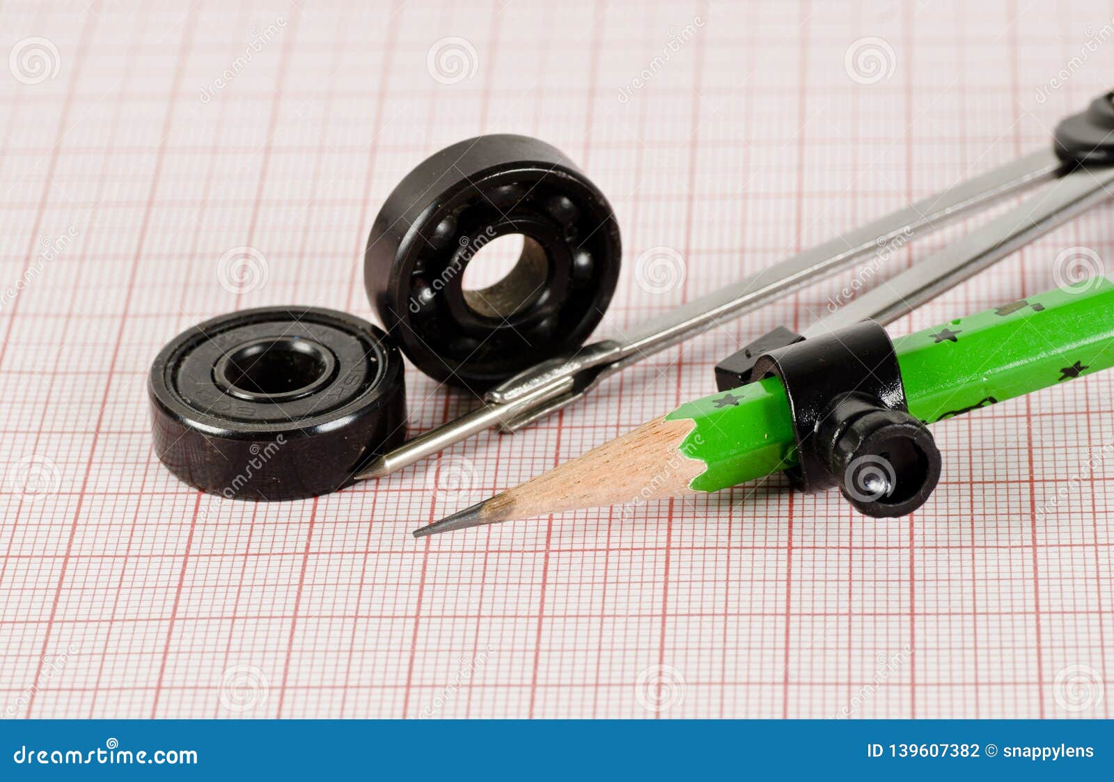 A Compass Placed On A Graph Paper Royalty-Free Stock Photo ...