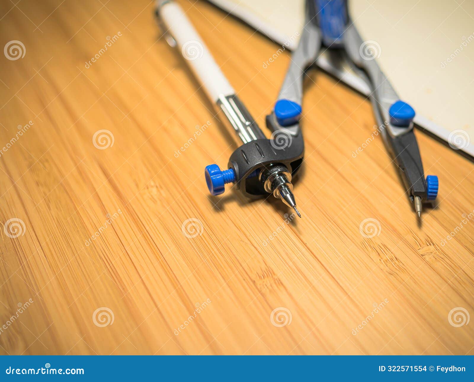 A Compass Resting on a Study Table. Stock Photo - Image of revision ...