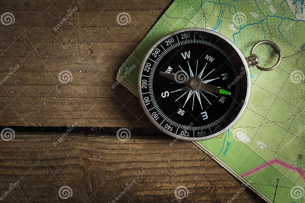 Compass on a road map stock image. Image of road, longitude - 28247439