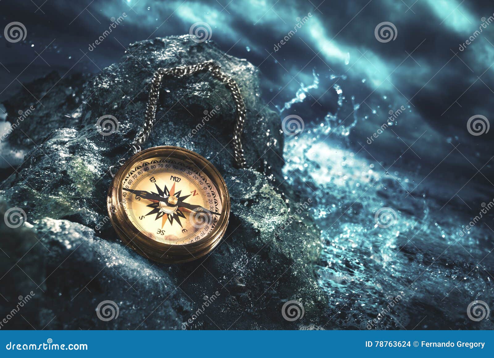 Compass on Rocks with a Dark Sky Stock Photo - Image of seashore, north ...