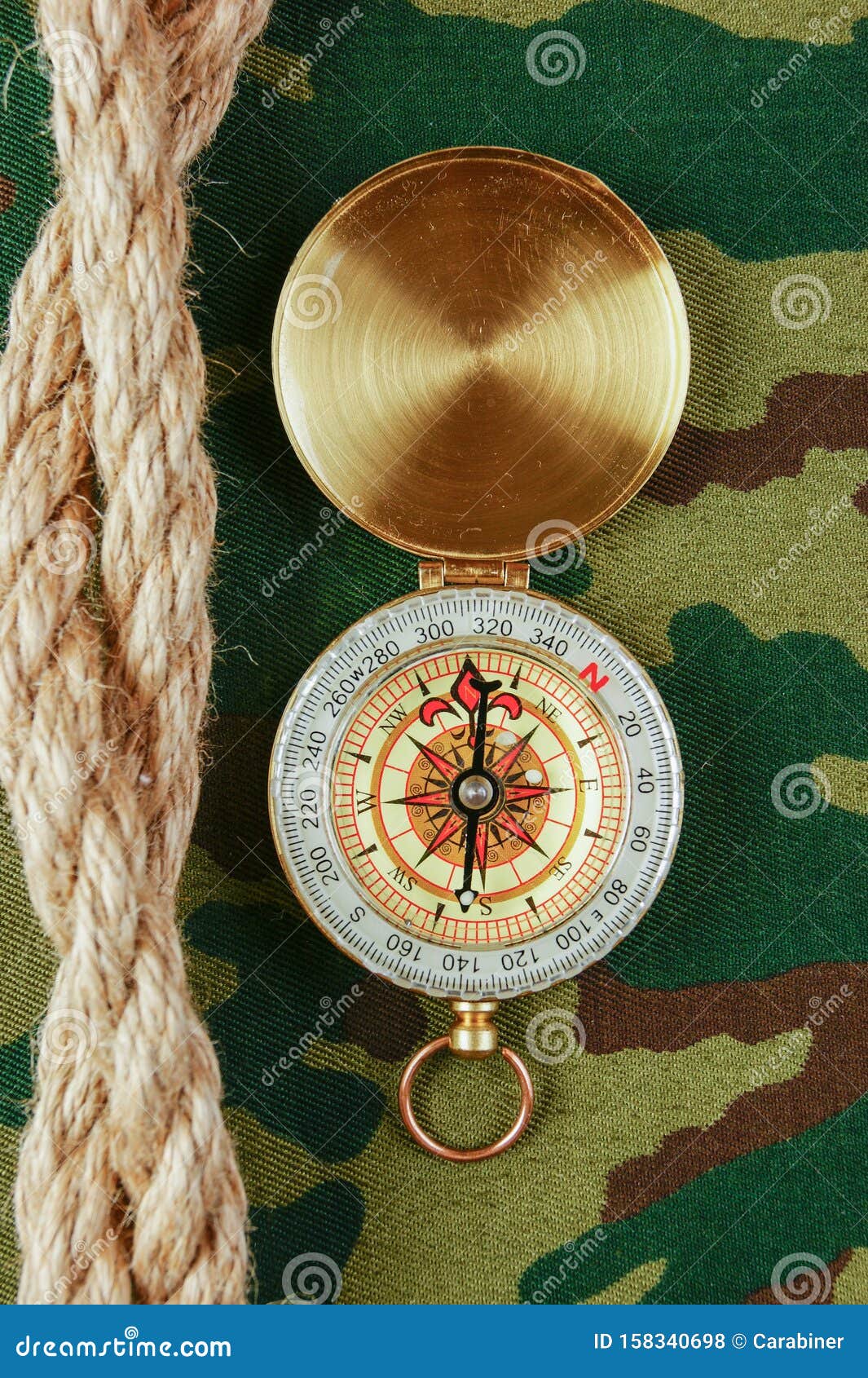 Compass and Rope on a Camouflage Stock Photo - Image of geography ...