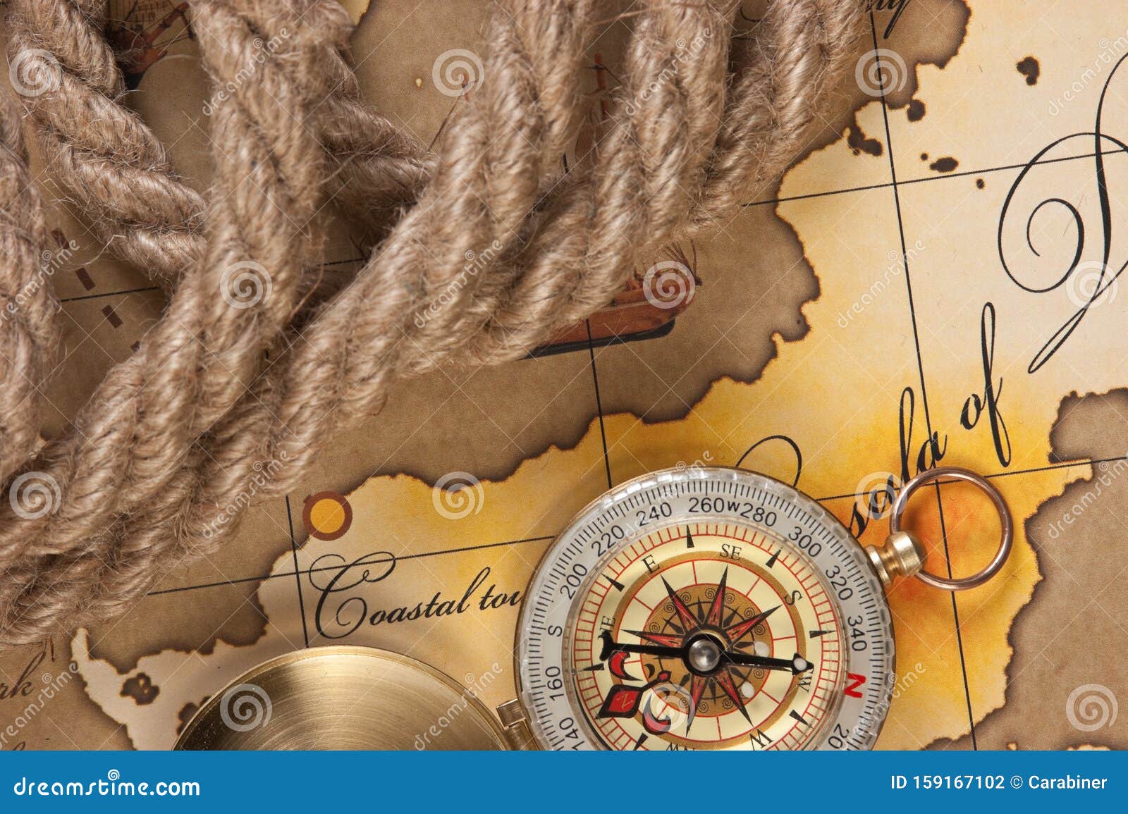 Compass and rope on map stock photo. Image of cartographer - 159167102