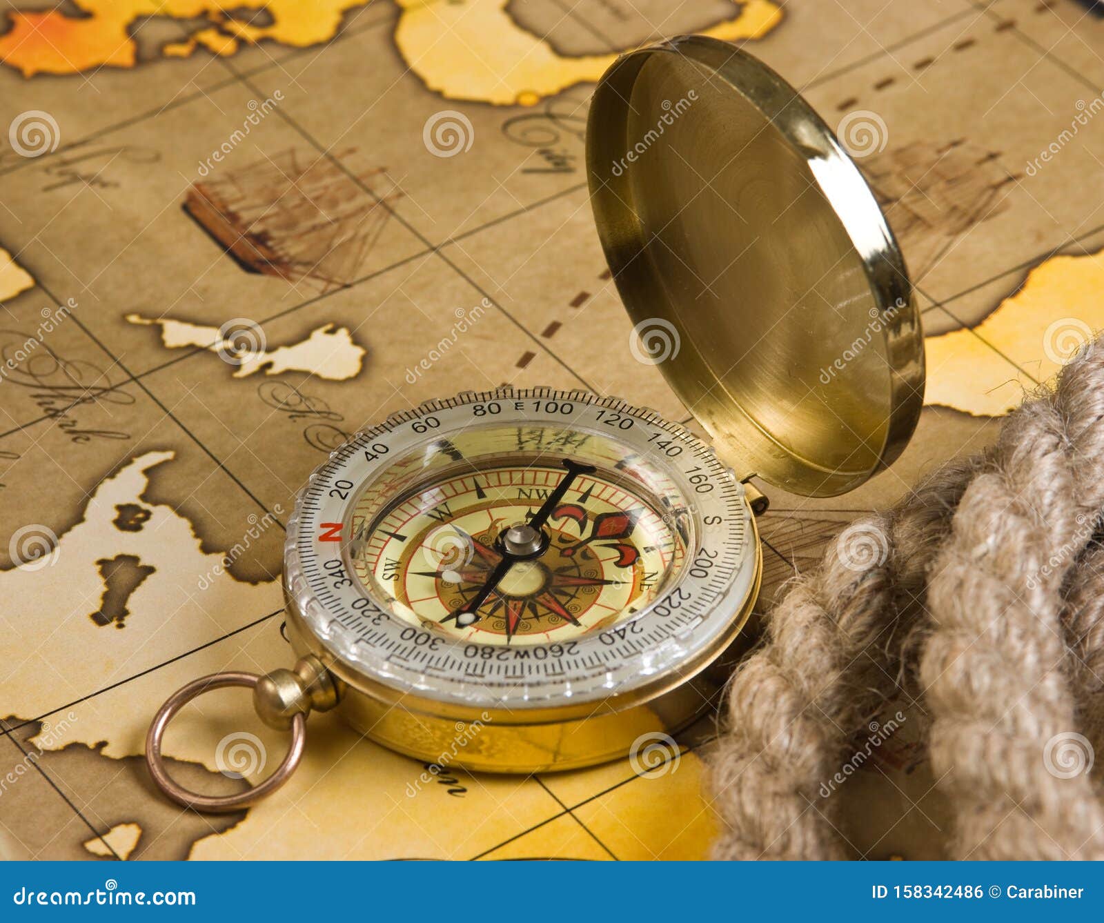 Compass and rope on map stock photo. Image of cartography - 158342486