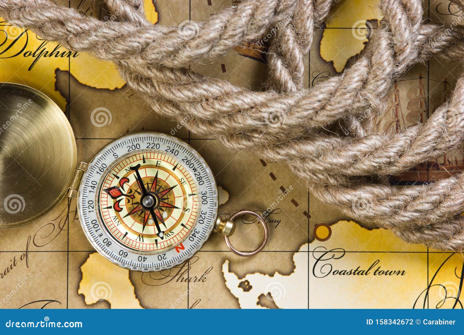Compass and rope on map stock photo. Image of education - 158342672