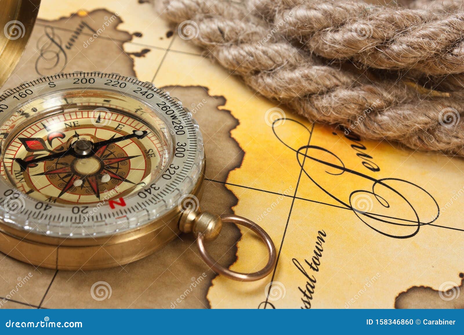 Compass and rope on map stock photo. Image of journey - 158346860