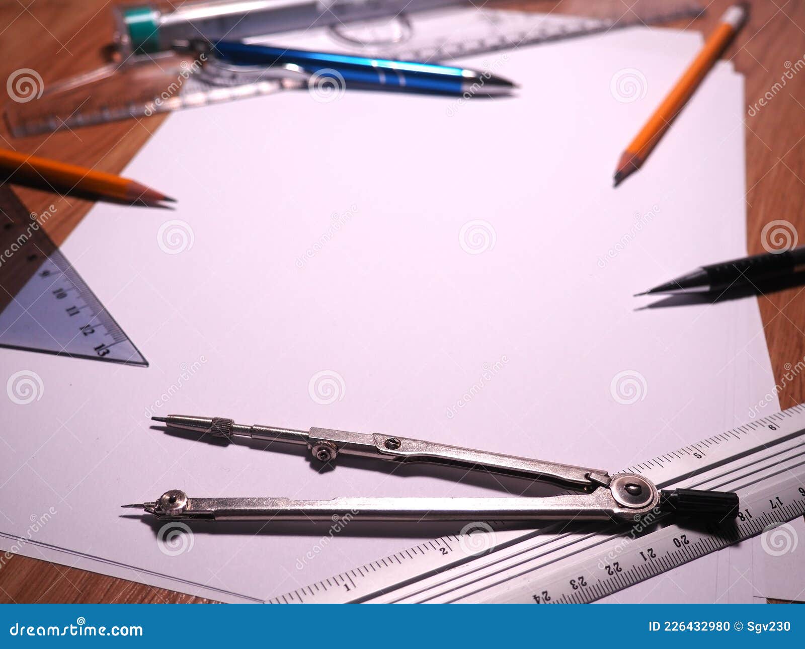 Compass, Ruler, Pencil and Sheet of Paper on the Table Stock Photo ...