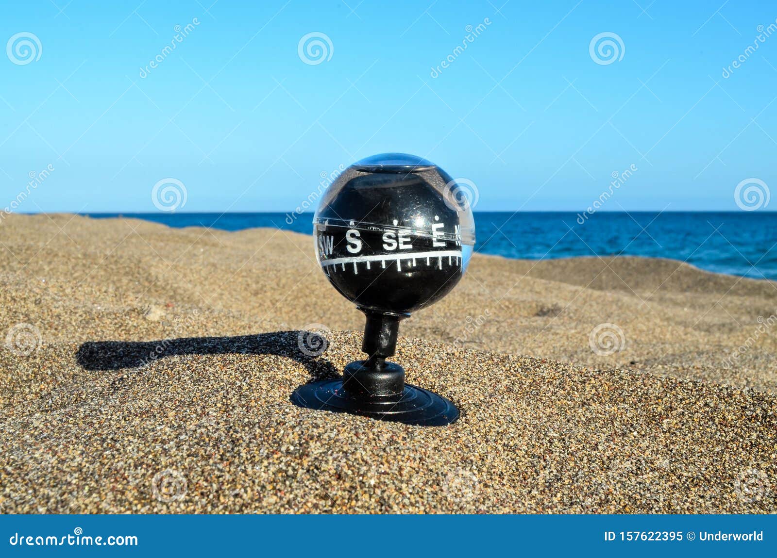 Compass on the Sand Beach stock image. Image of north - 157622395