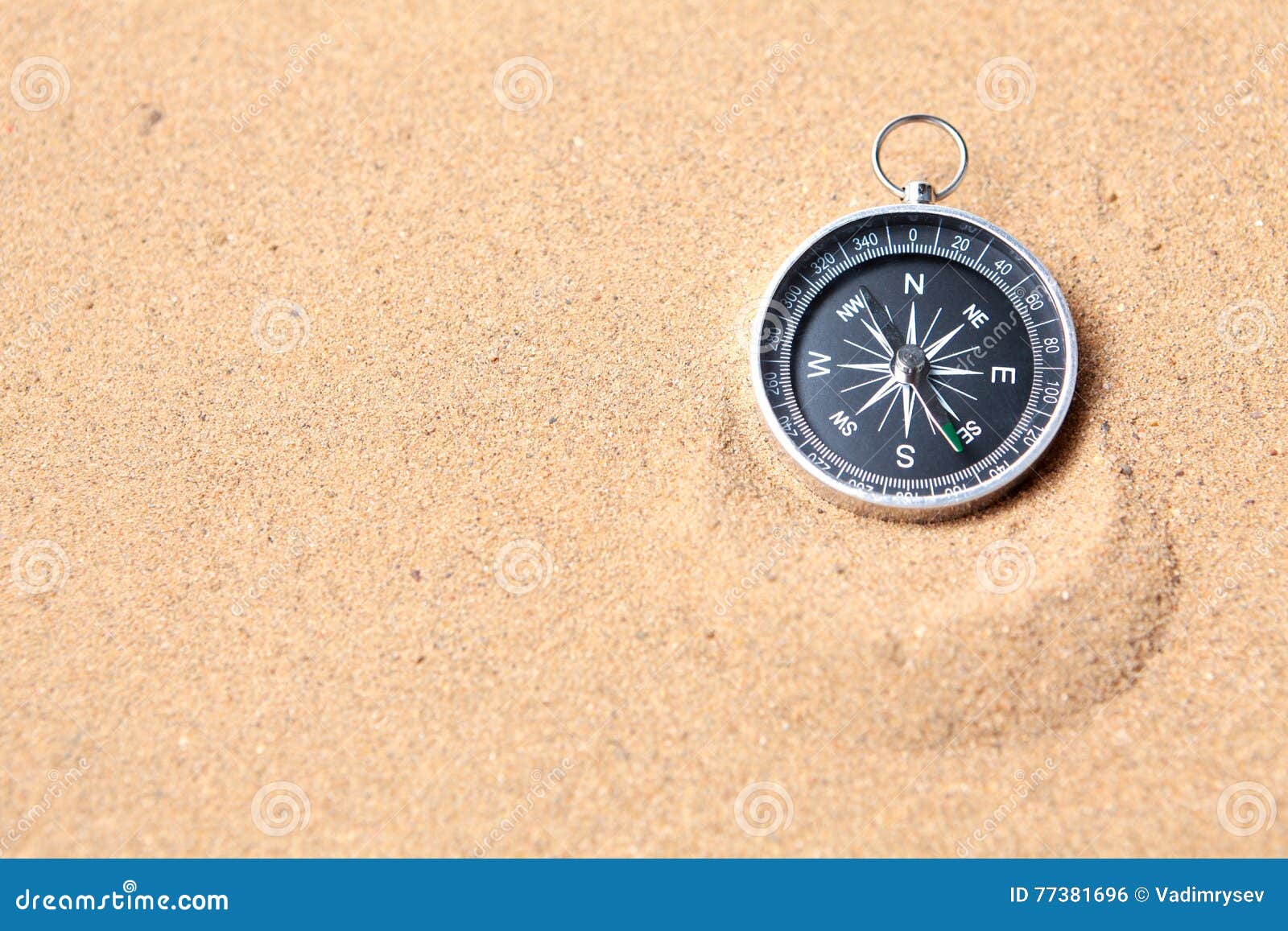 Compass on the sea sand stock photo. Image of concepts - 77381696