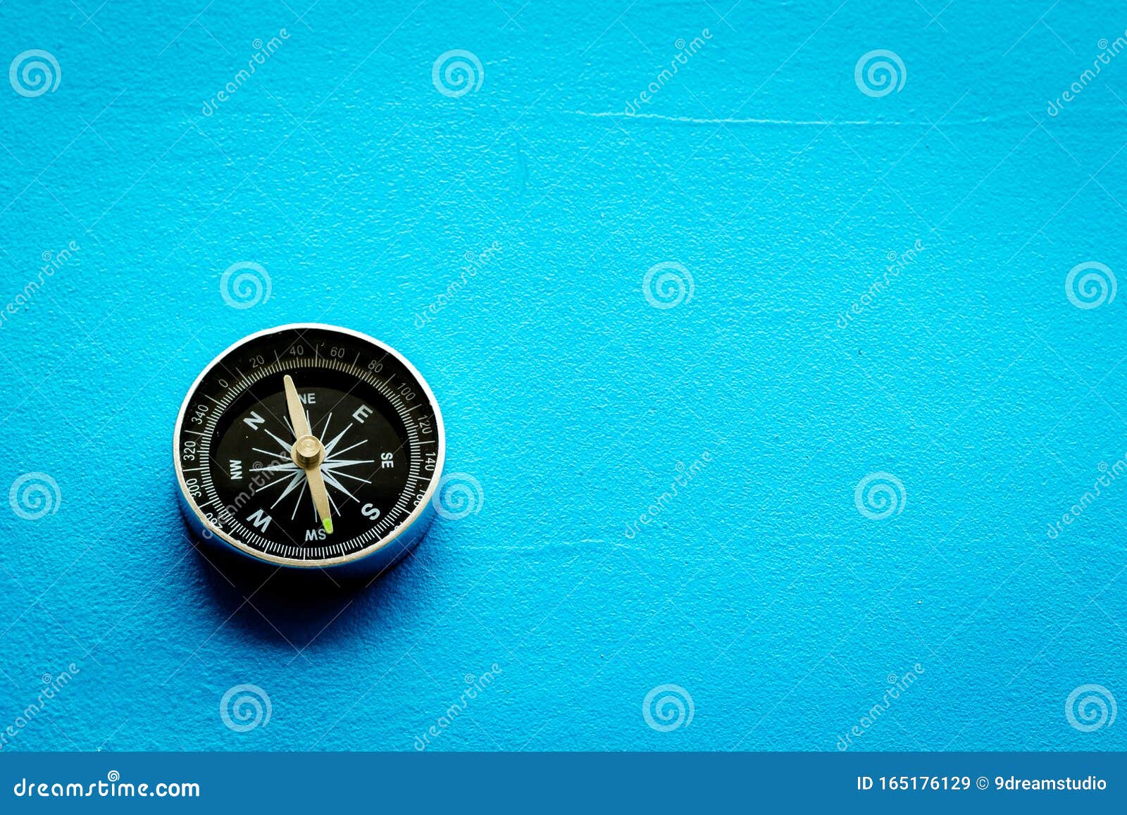 Compass - Small and Stylish - on Blue Background Copy Space Stock Image ...