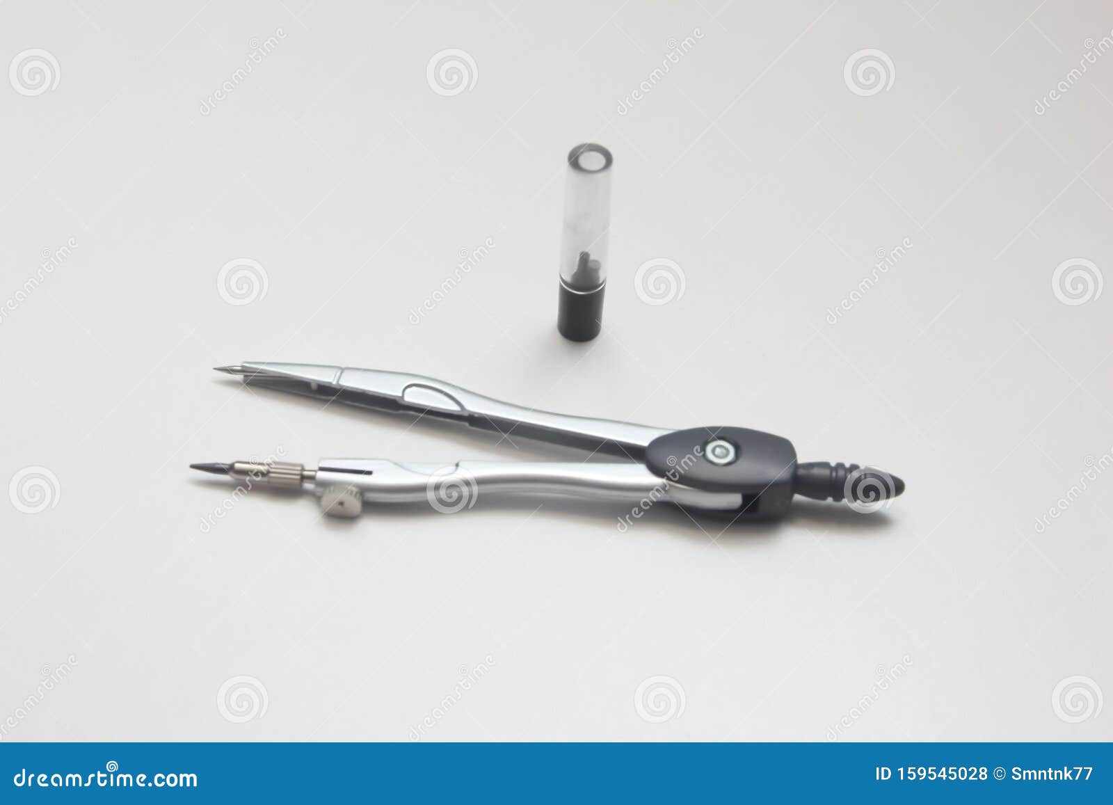 Compass For Sketching And Eraser On White Paper Stock Image ...