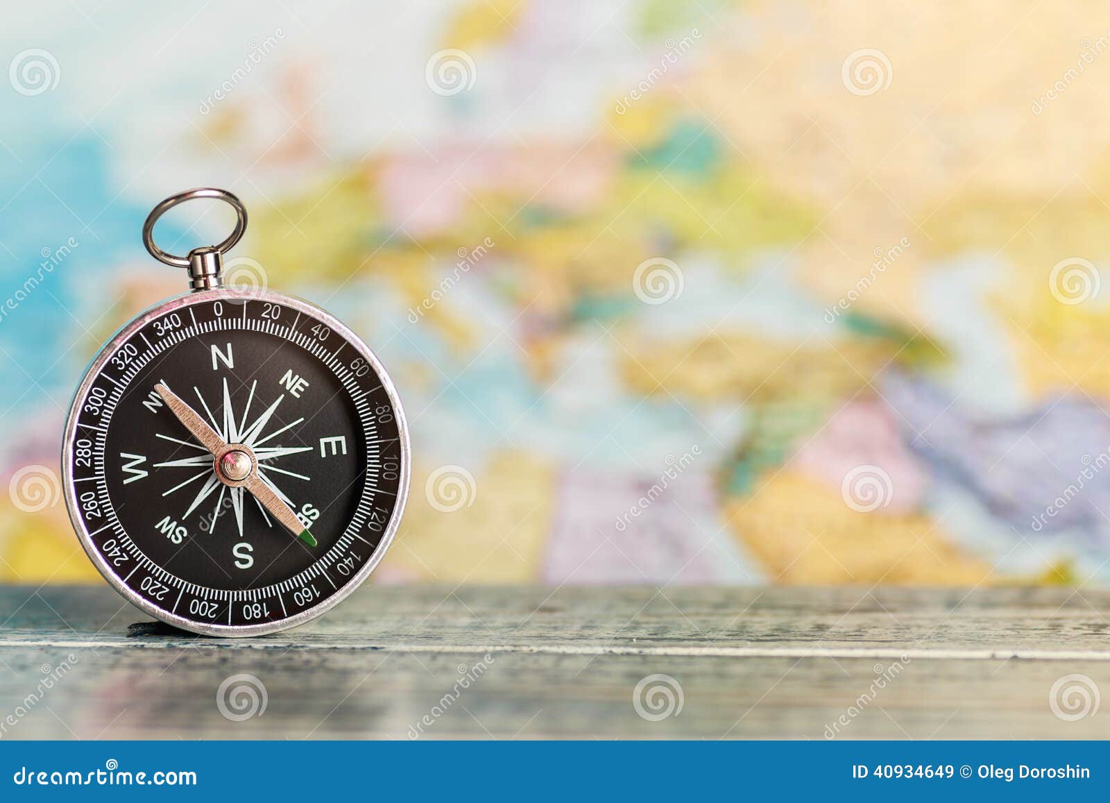 Compass on the Table Against the Background of a Tourist Map Stock ...