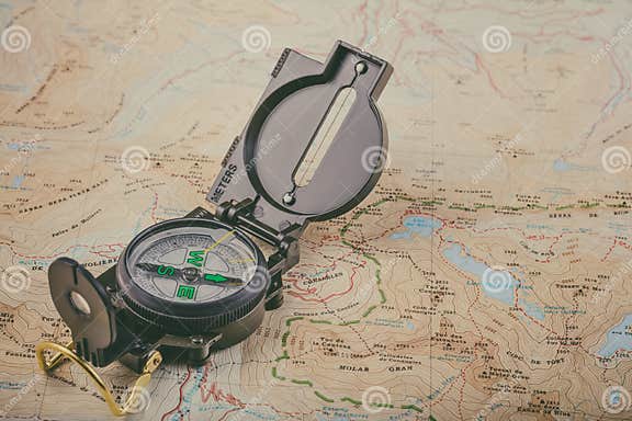 Compass on topographic map stock image. Image of hiking - 131756347