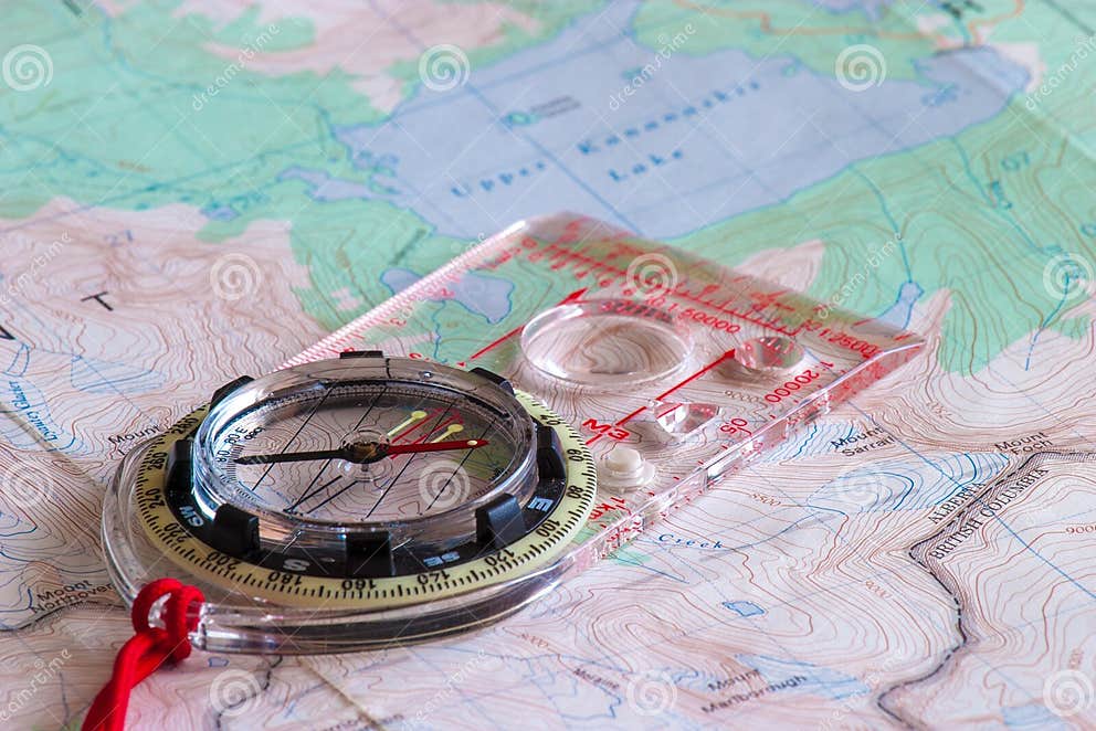 Compass and a Topographic Map Stock Photo - Image of navigational ...