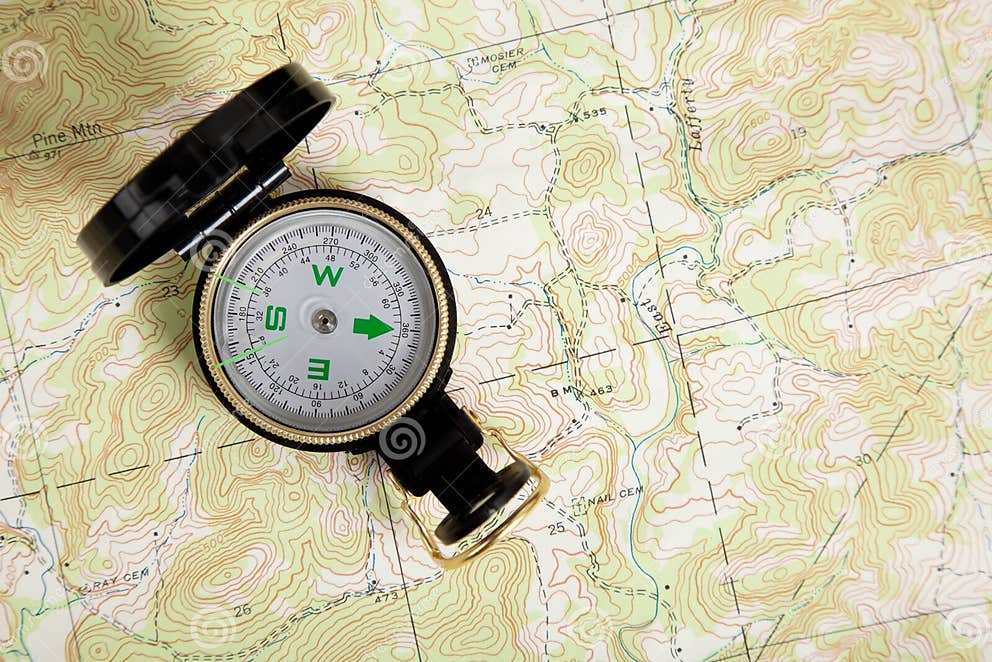 Compass on a Topographical Map Stock Photo - Image of lines, east: 11938152