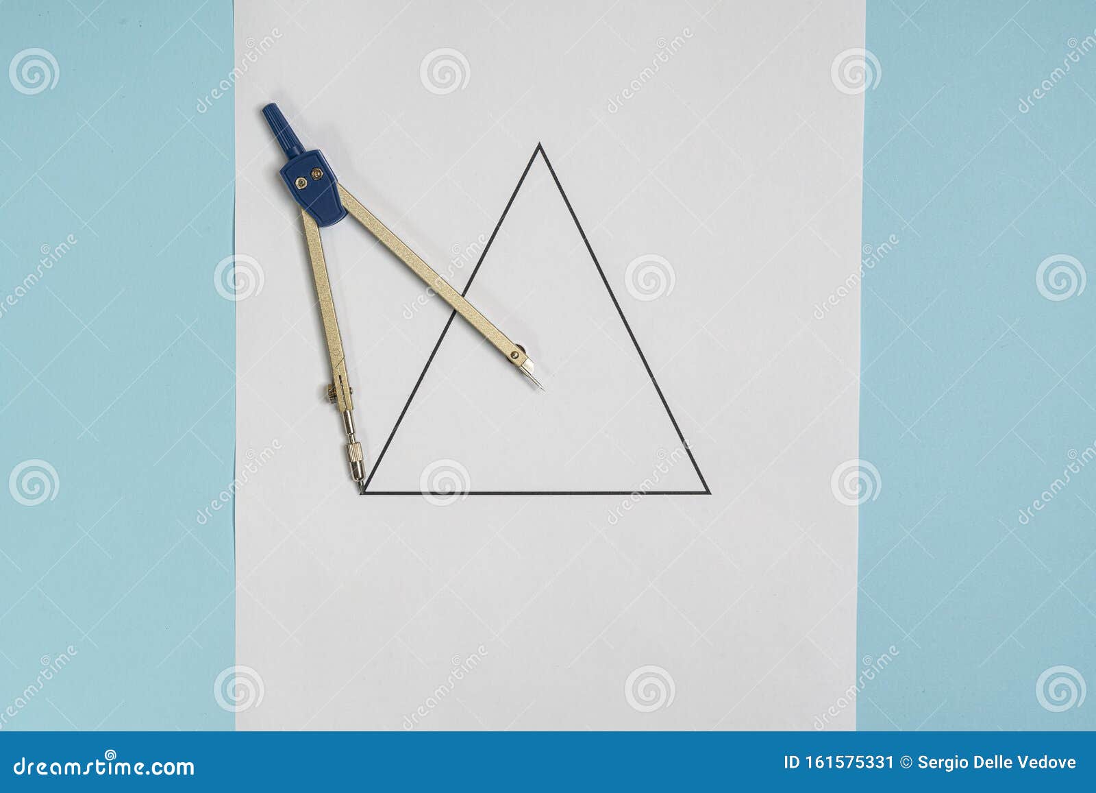 The compass and a triangle stock image. Image of compass - 161575331